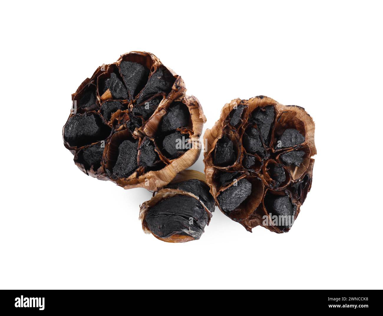 Organic fermented black garlic isolated on white, top view Stock Photo ...