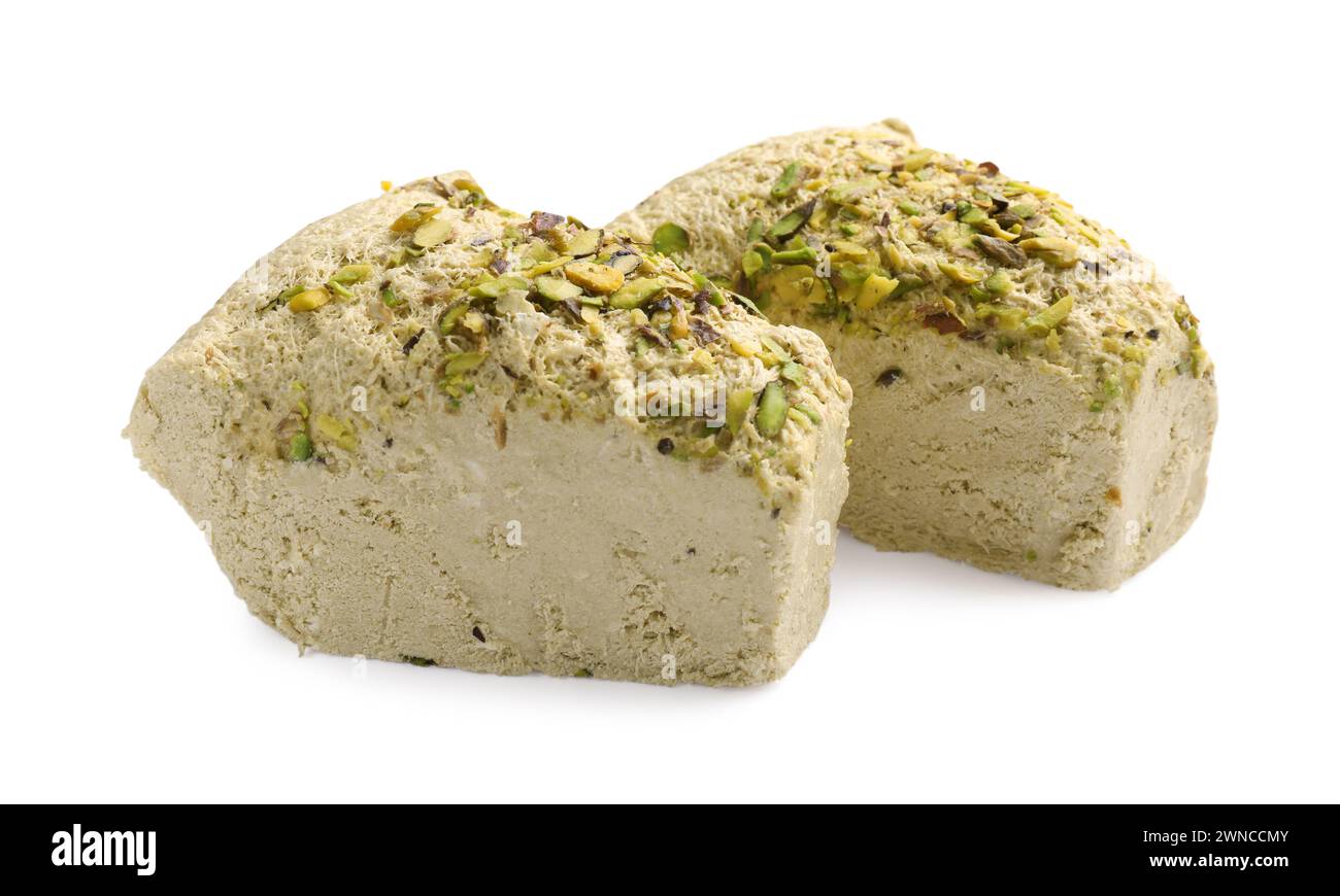Pieces of tasty halva with pistachios on white background Stock Photo - Alamy