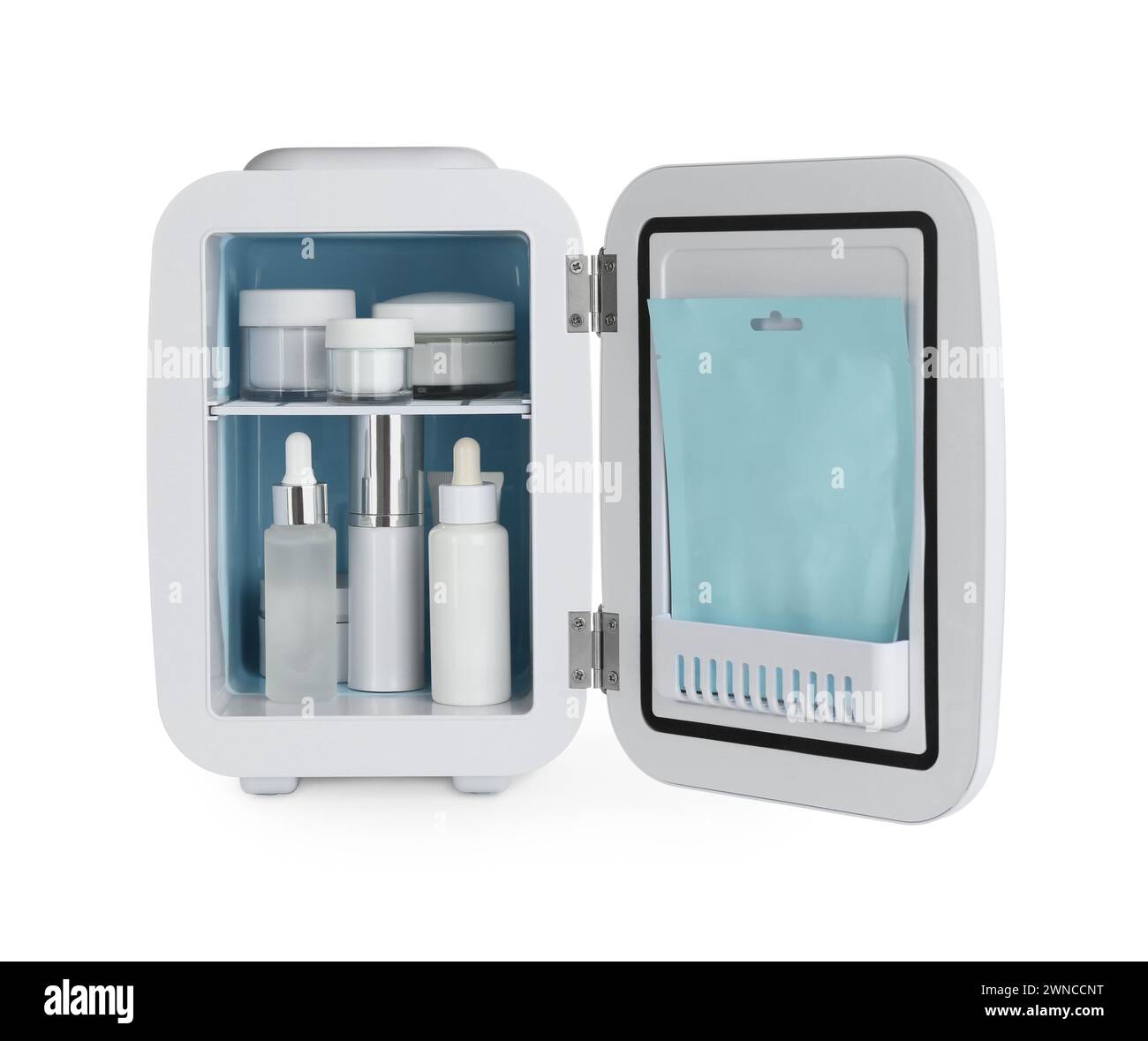 Cosmetics refrigerator with skin care products isolated on white Stock ...