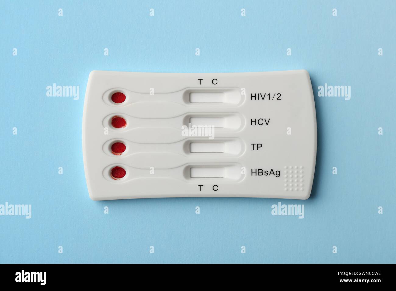 Disposable multi-infection express test on light blue background, top ...