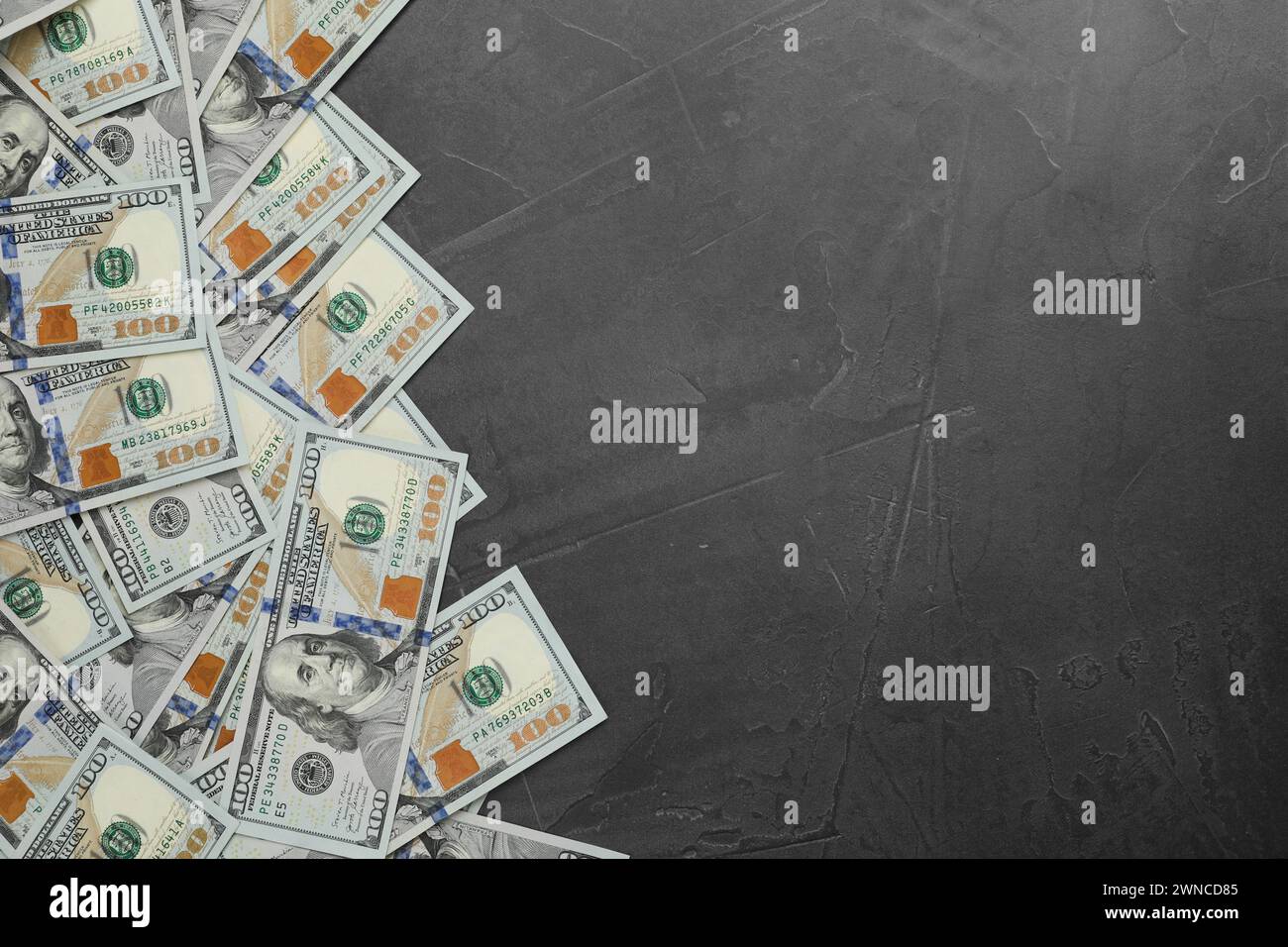 Money exchange. Dollar banknotes on dark gray textured background, top ...