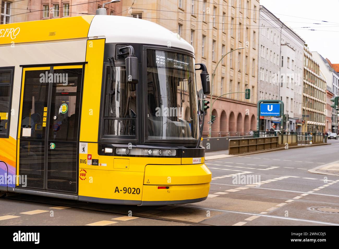 yellow tram Generation Flexity Berlin driving down city street in ...
