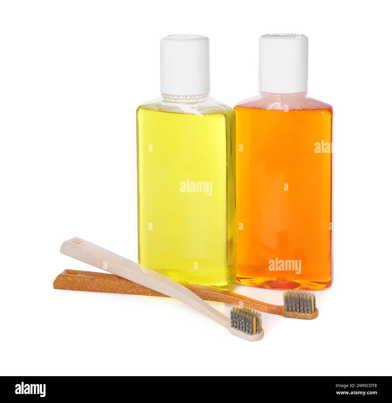 Bottles of mouthwash and toothbrushes isolated on white Stock Photo - Alamy