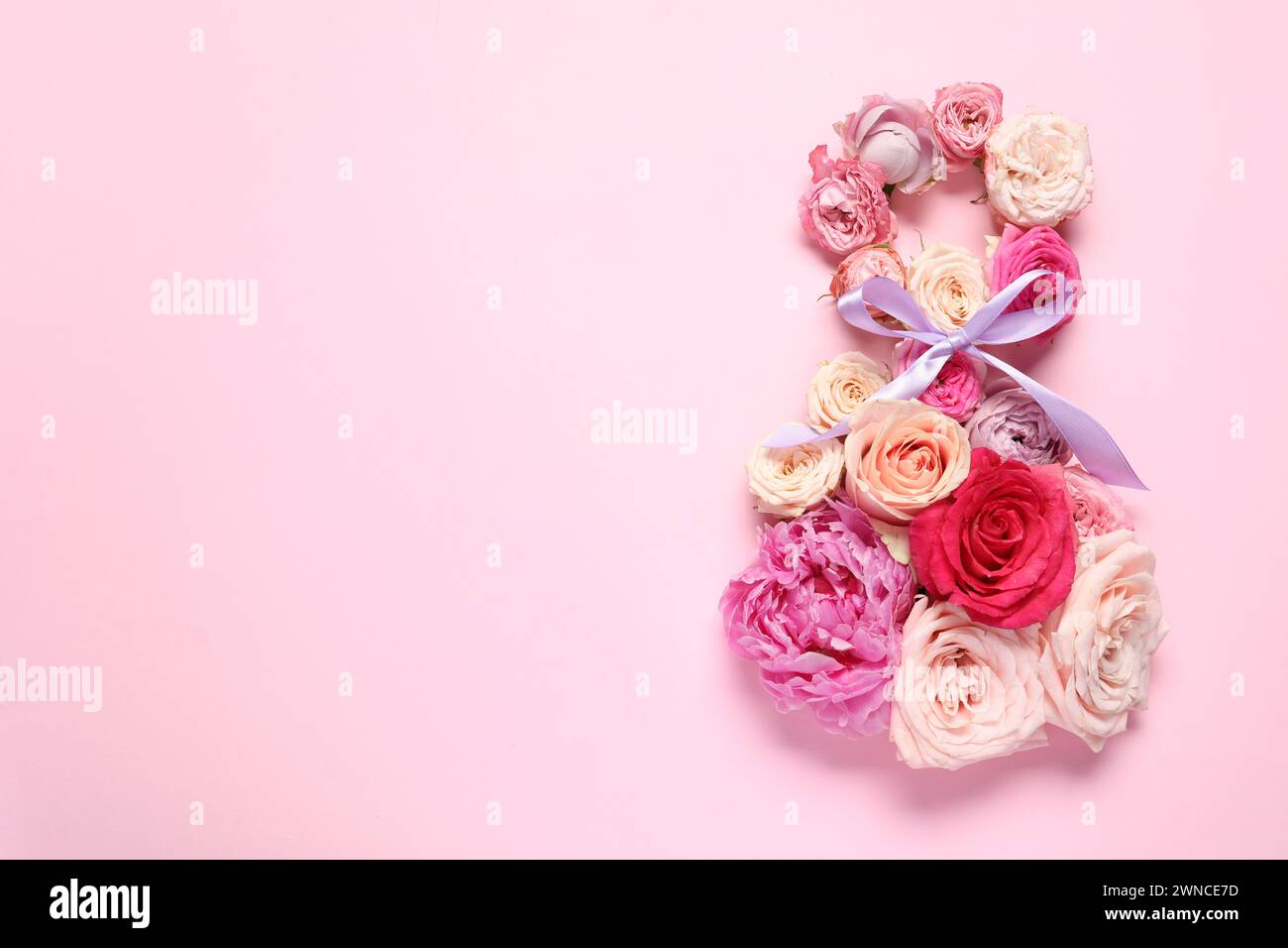 8 March greeting card design made with beautiful flowers on pink ...