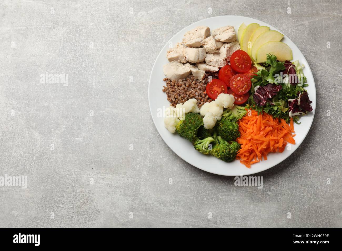 Balanced diet and healthy foods. Plate with different delicious ...