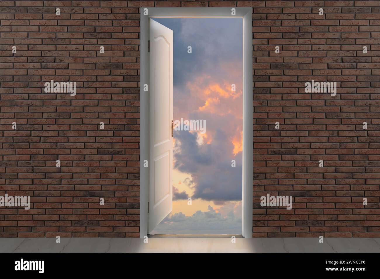 Beautiful sunset sky visible through open door Stock Photo - Alamy