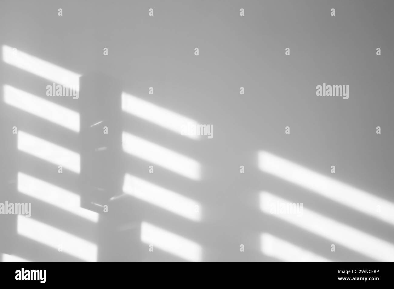 Light and shadows falling on white wall Stock Photo - Alamy