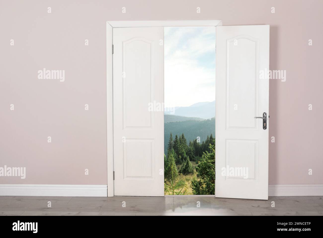 Beautiful mountain landscape visible through open door Stock Photo - Alamy