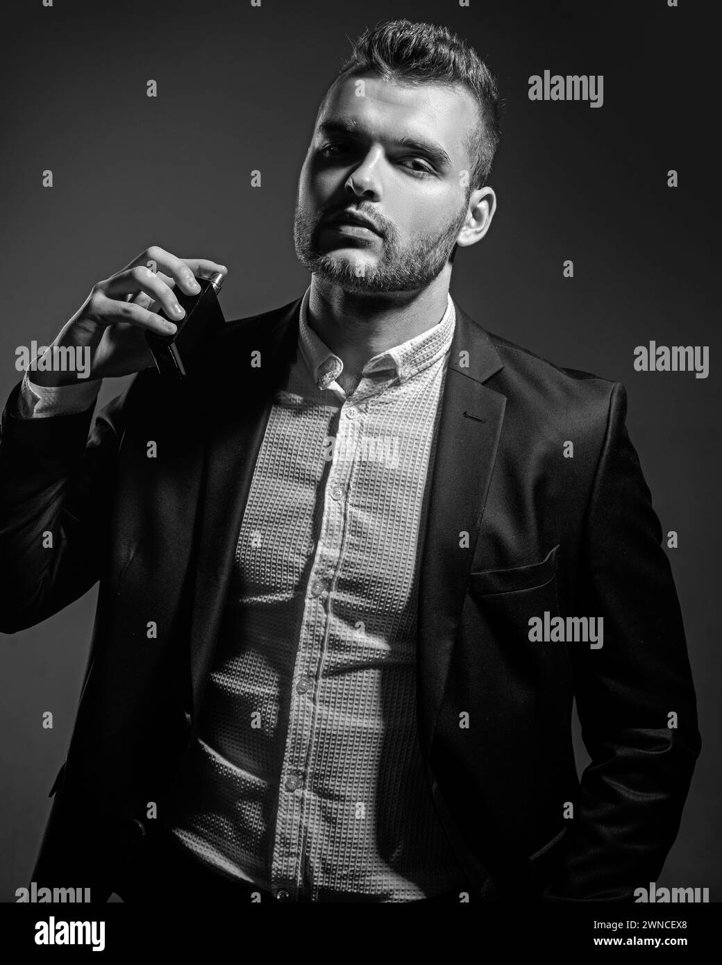 male smell. Man holding bottle of perfumery. Mans perfume concept ...