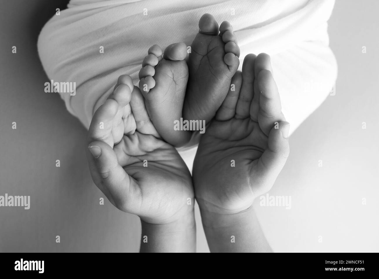 Studio macro black and white photo of a child's toes, heels and feet ...