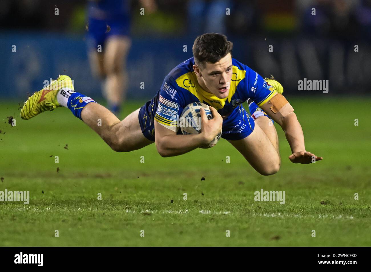 Josh Thewlis of Warrington Wolves is tap tackled during the Betfred ...