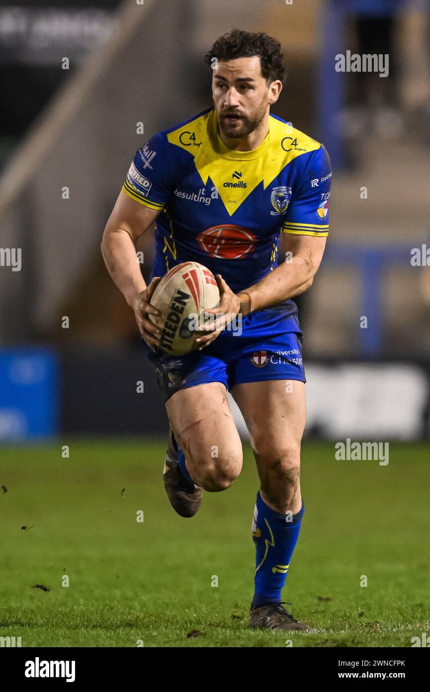 Toby King of Warrington Wolves makes a break during the Betfred Super ...