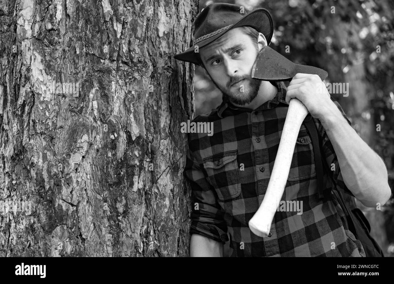 Portrait of a handsome man in forest Black and White Stock Photos ...