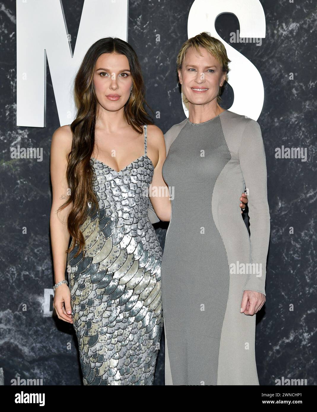 Millie Bobby Brown, left, and Robin Wright attend the premiere of ...
