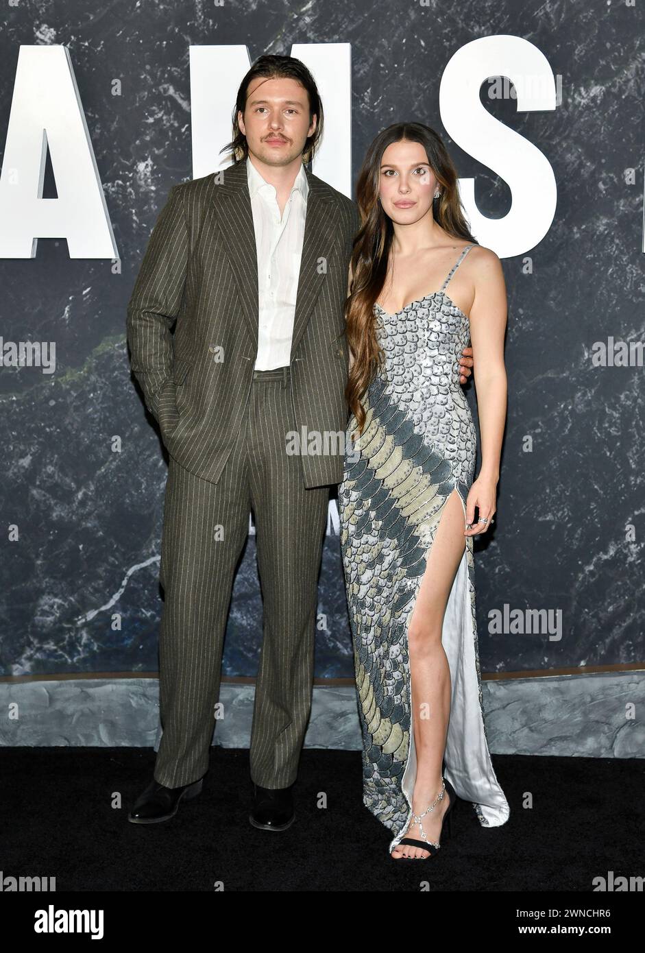 Nick Robinson, left, and Millie Bobby Brown attend the premiere of ...