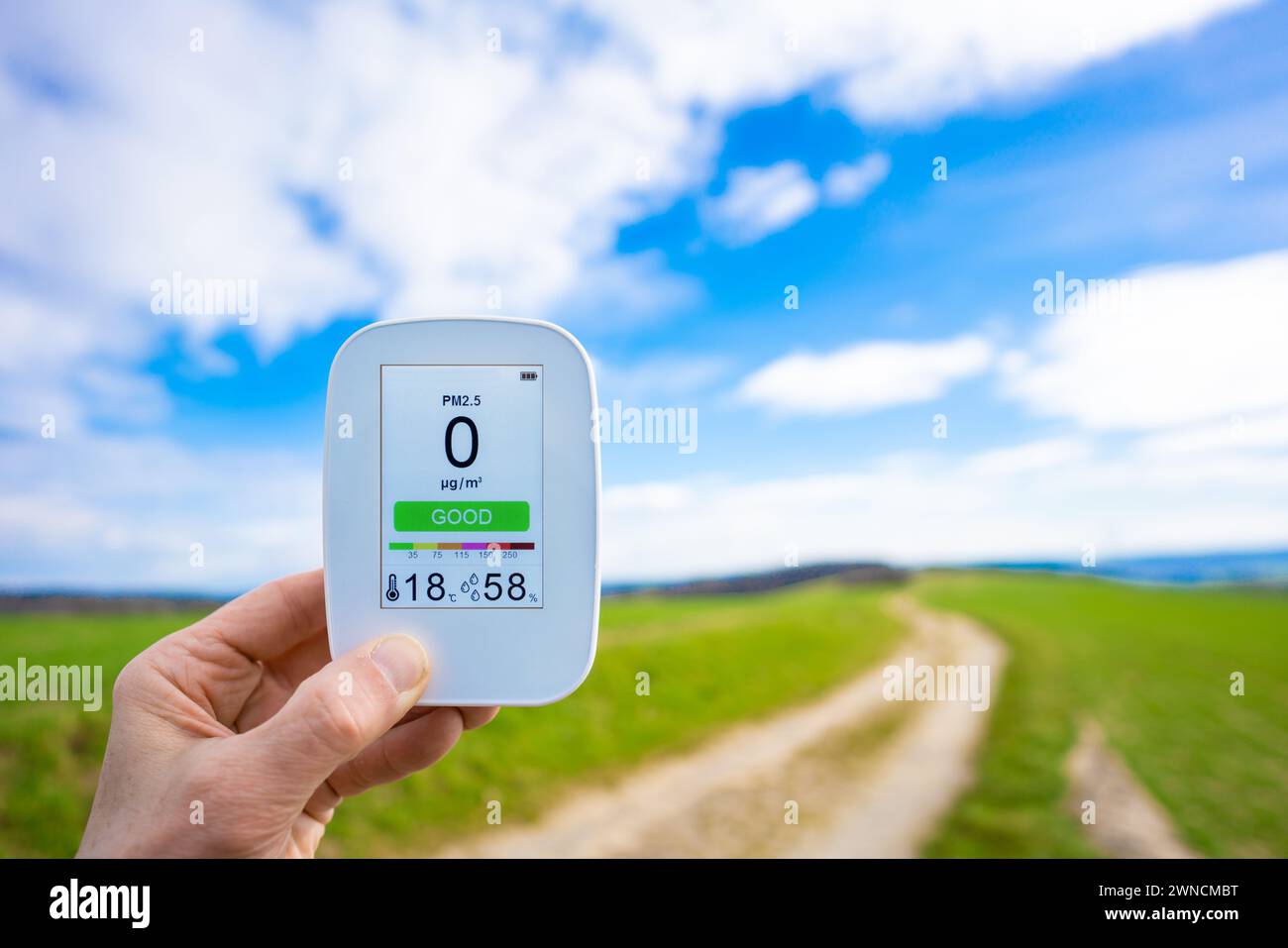 Hand holding air quality detector Stock Photo - Alamy