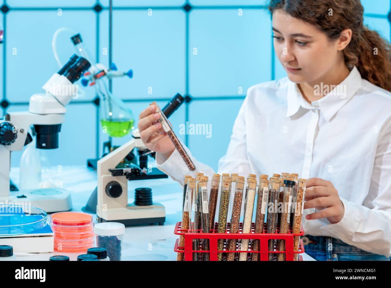 Scientist analysing substance in test tube Stock Photo - Alamy