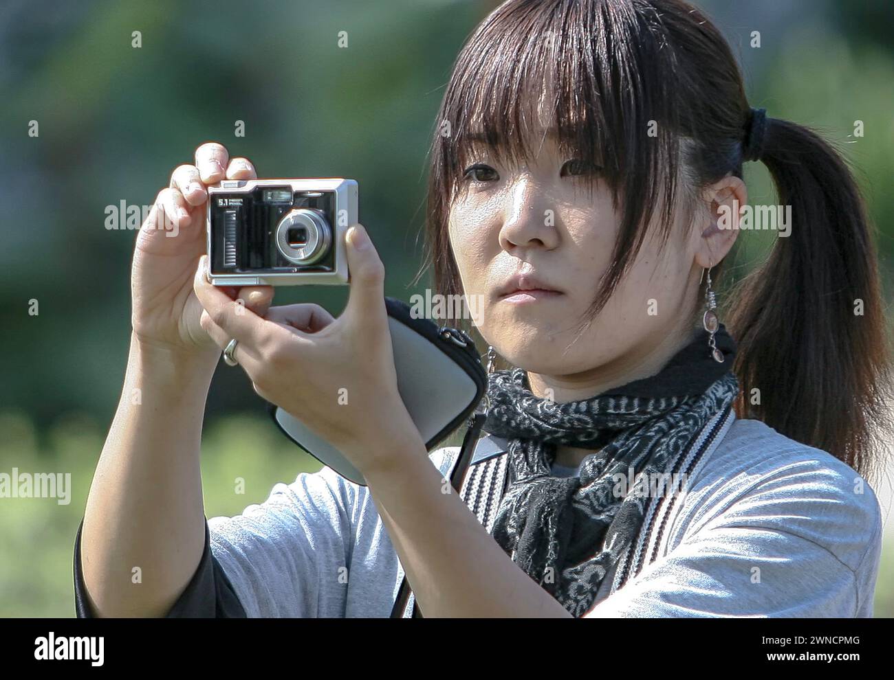 Young Chinese woman with a camera Stock Photo - Alamy