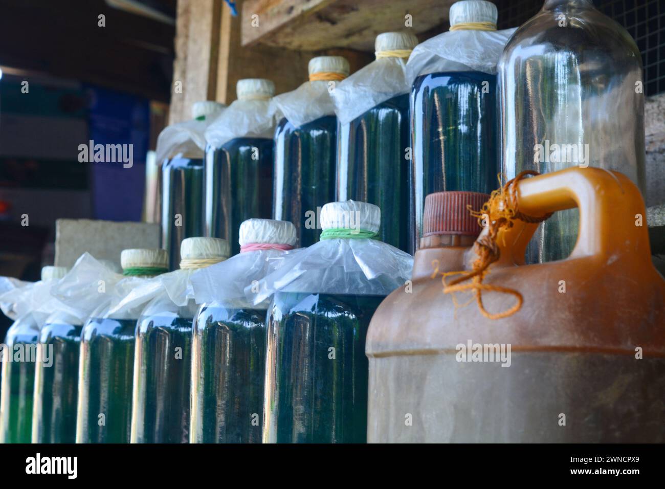Gasoline sold in retail uses liter bottles Stock Photo - Alamy