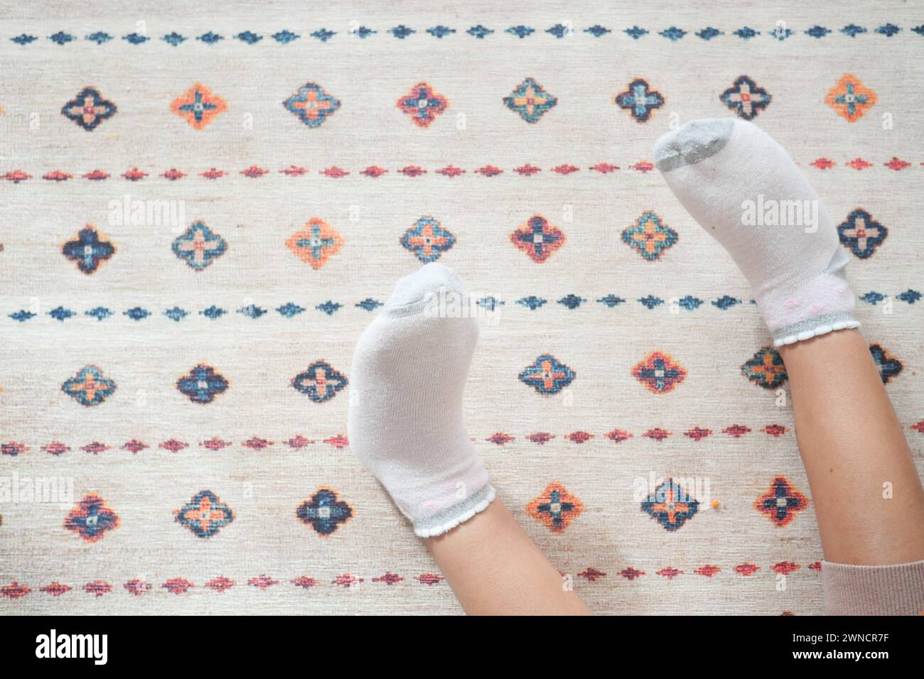 top view of child feet on a carpet Stock Photo - Alamy