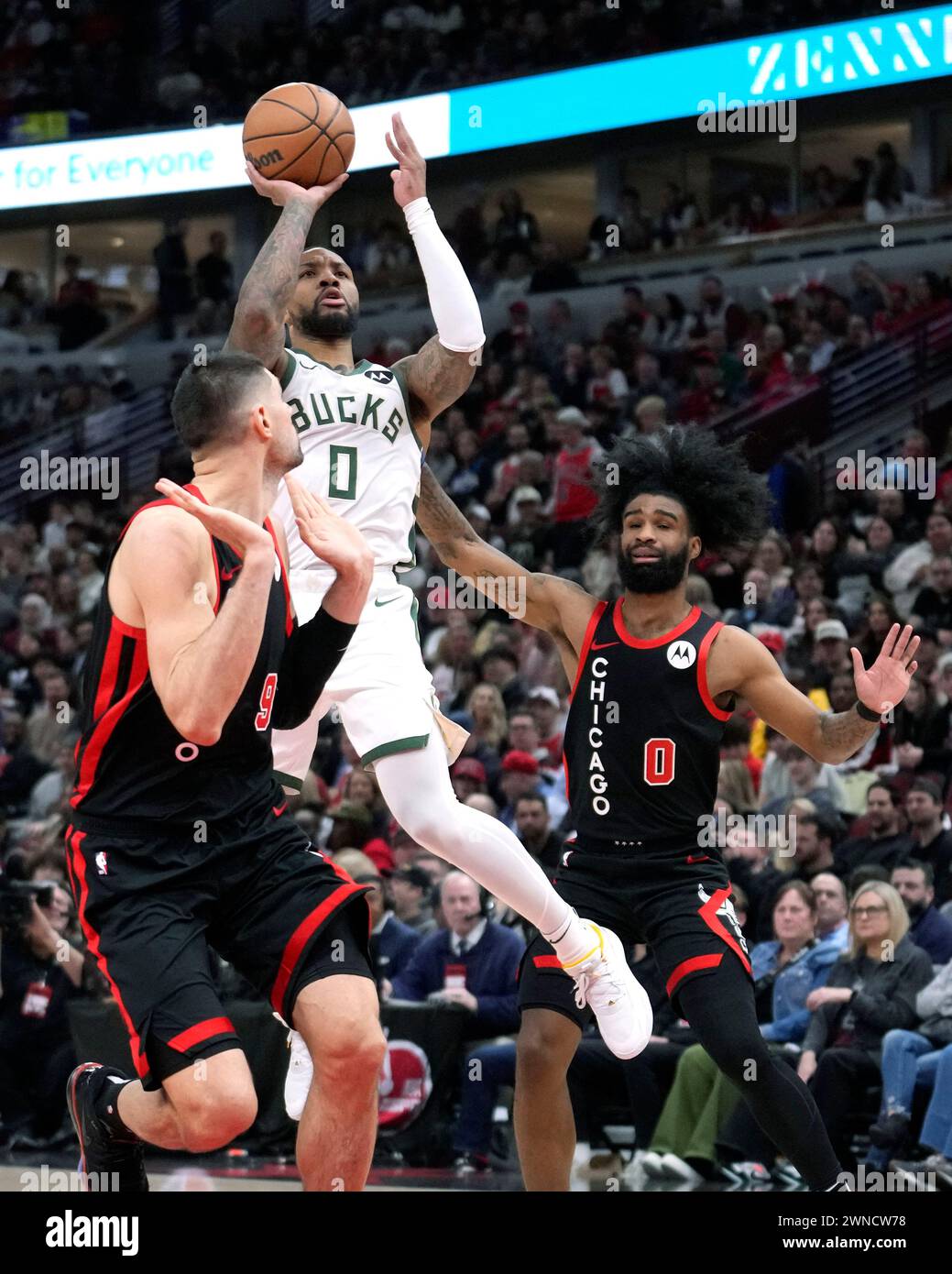 Milwaukee Bucks' Damian Lillard shoots as Chicago Bulls' Coby White (0 ...