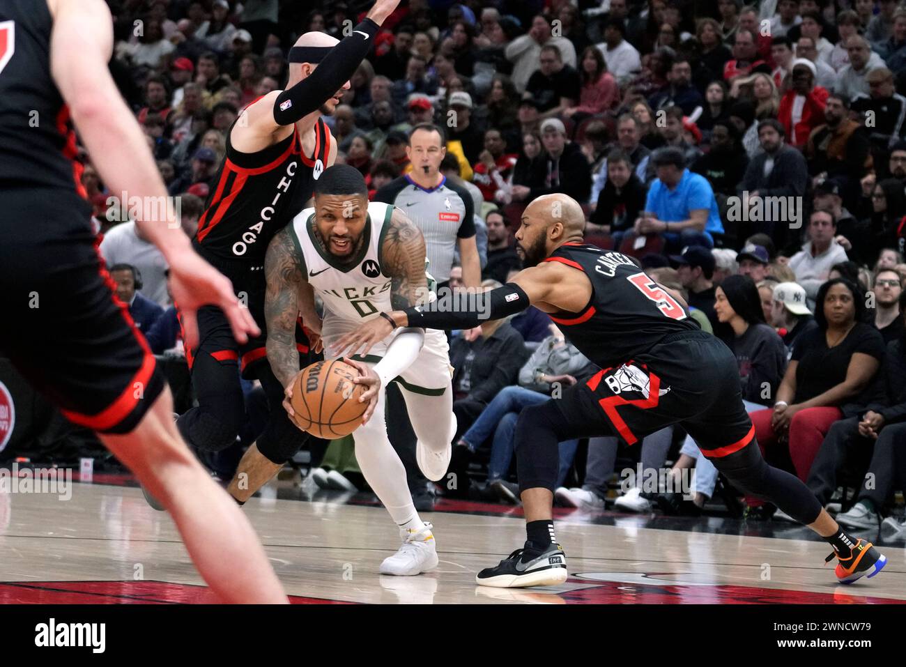 Milwaukee Bucks' Damian Lillard drives to the basket between Chicago ...