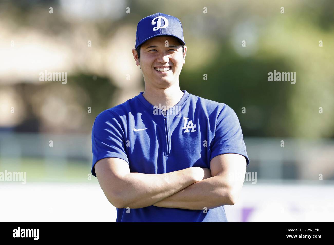 Shohei Ohtani of the Los Angeles Dodgers smiles during practice before ...
