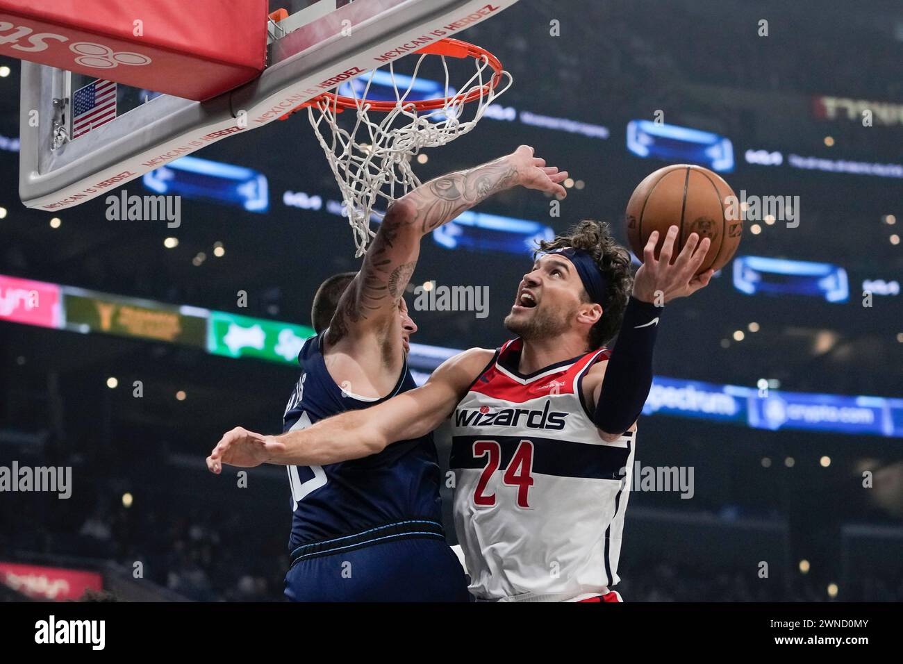 Washington Wizards forward Corey Kispert, right, shoots against Los ...