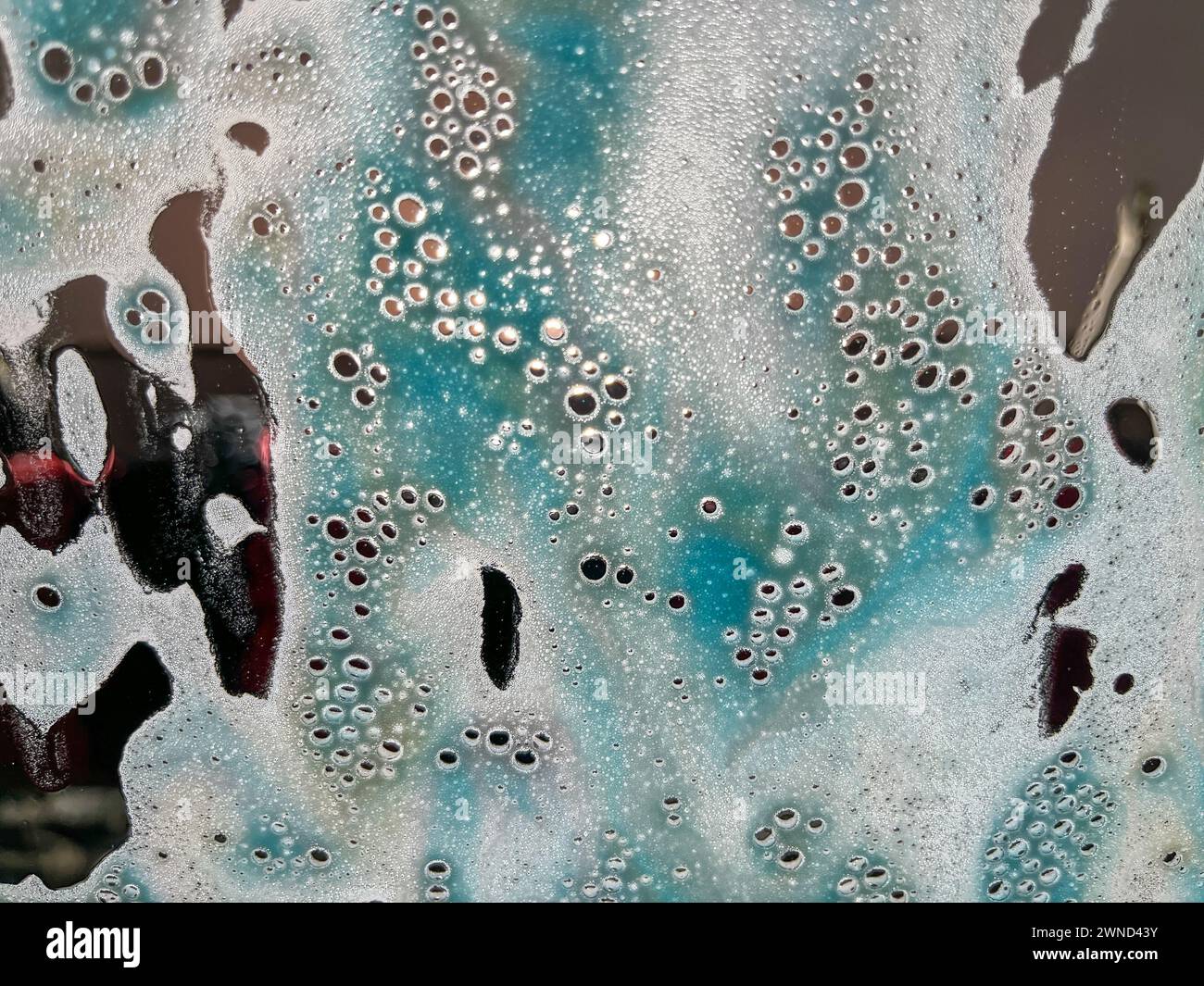 Abstract texture background of water and suds spraying on the ...