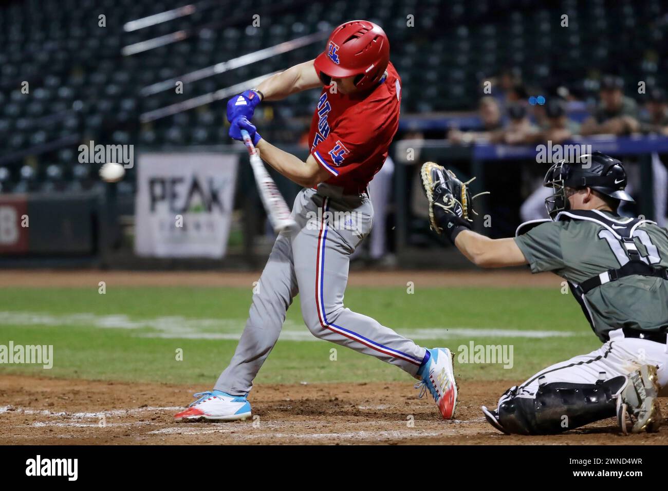 Louisiana Tech batter Cole McConnell, left, swings on his two run home ...