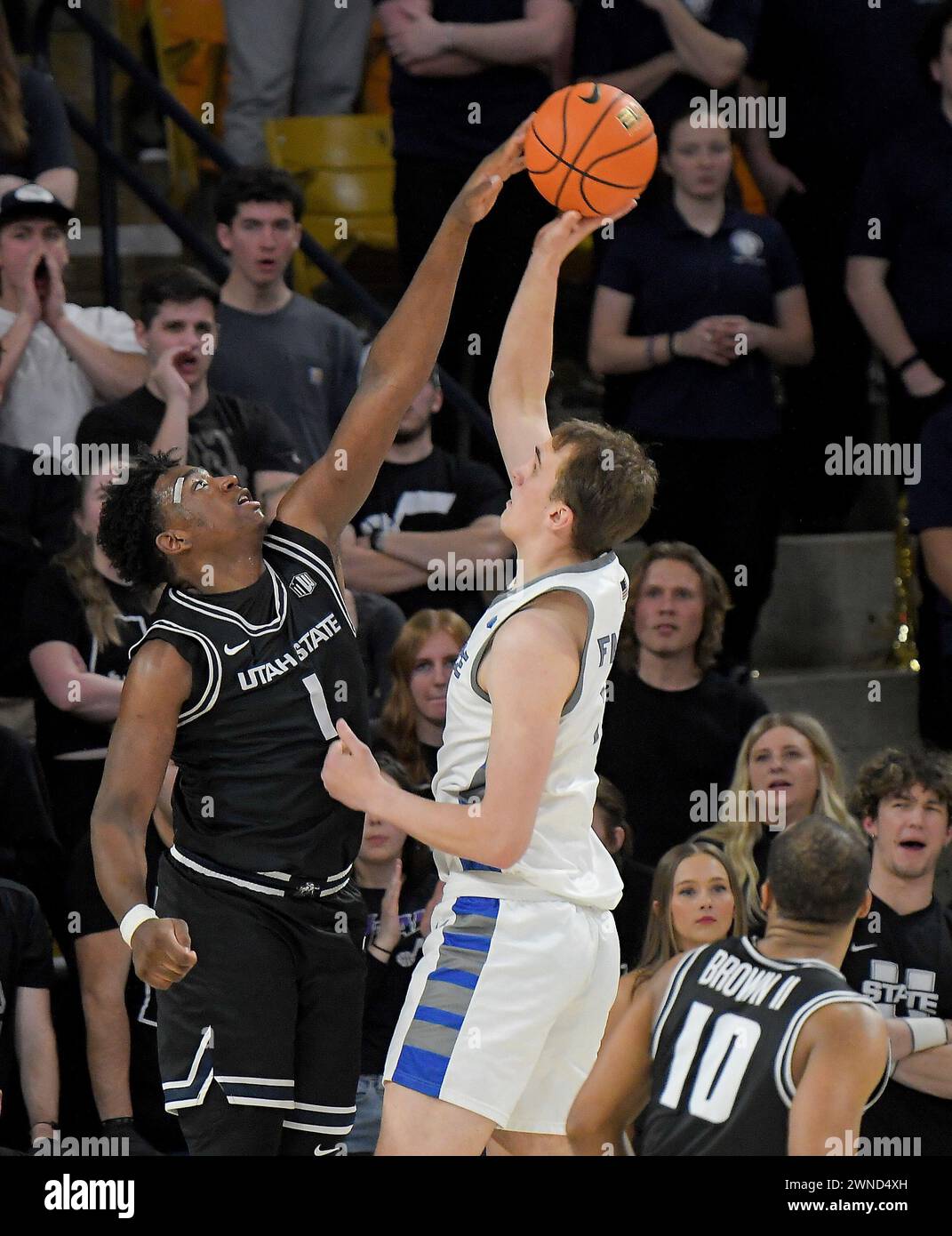 Utah State forward Great Osobor (1) blocks a shot by Air Force center ...