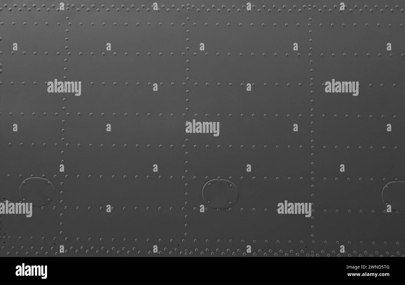 Aircraft skin close up. Rivets on gray metal. Iron panel of airplane ...
