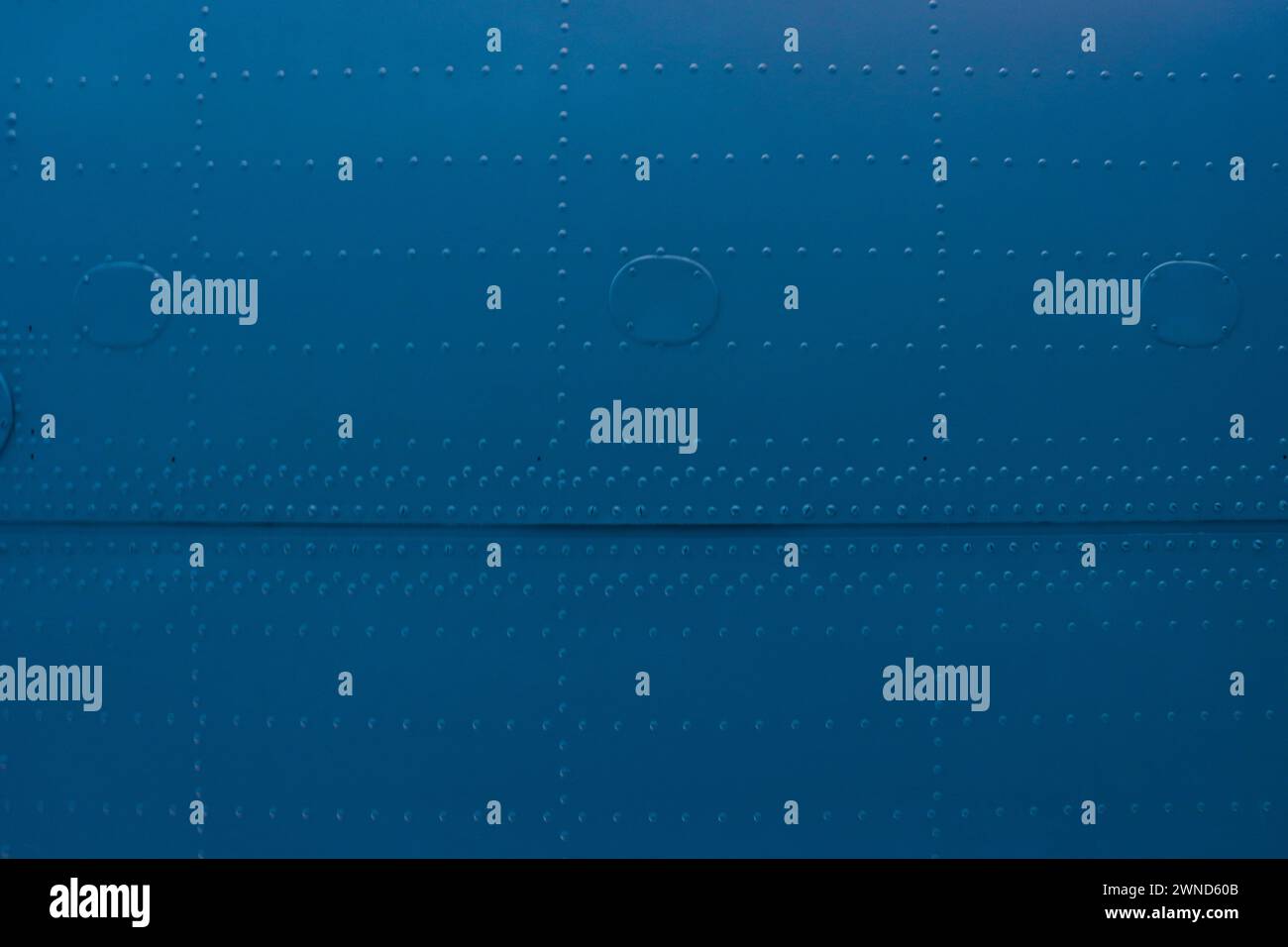 Aircraft skin close up. Detail of an old grunge blue metal plate piece ...