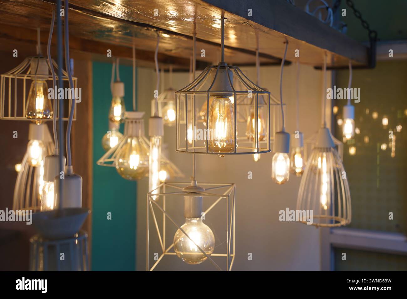 Light bulbs hanging from the ceiling hi-res stock photography and ...