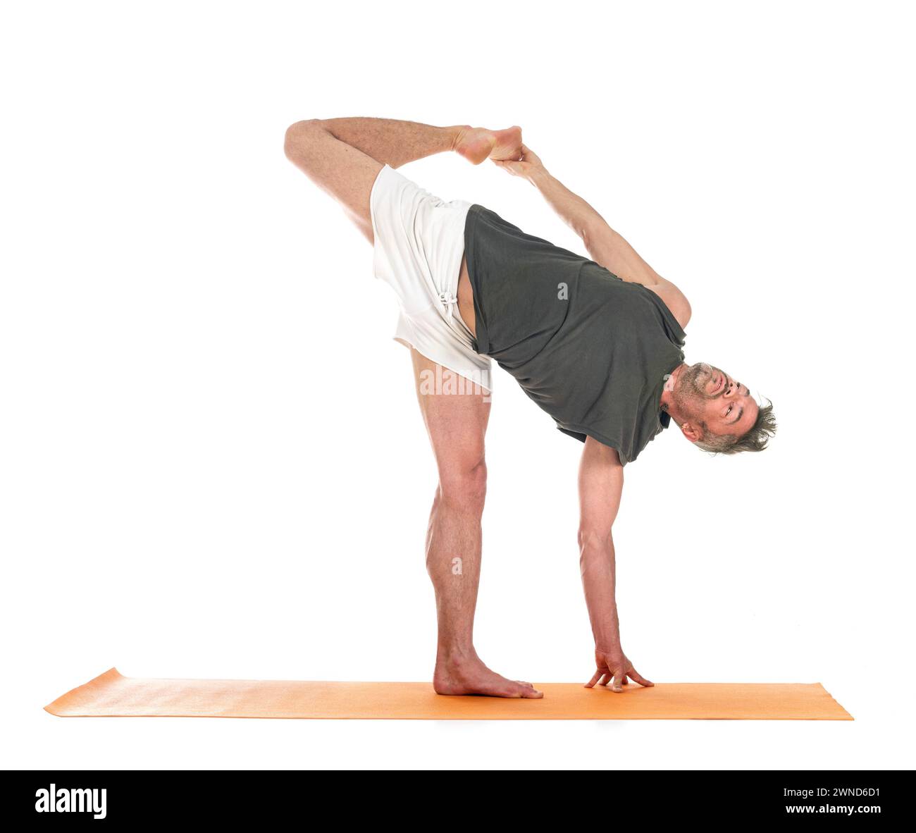 man and hatha yoga asana in front of white background Stock Photo - Alamy