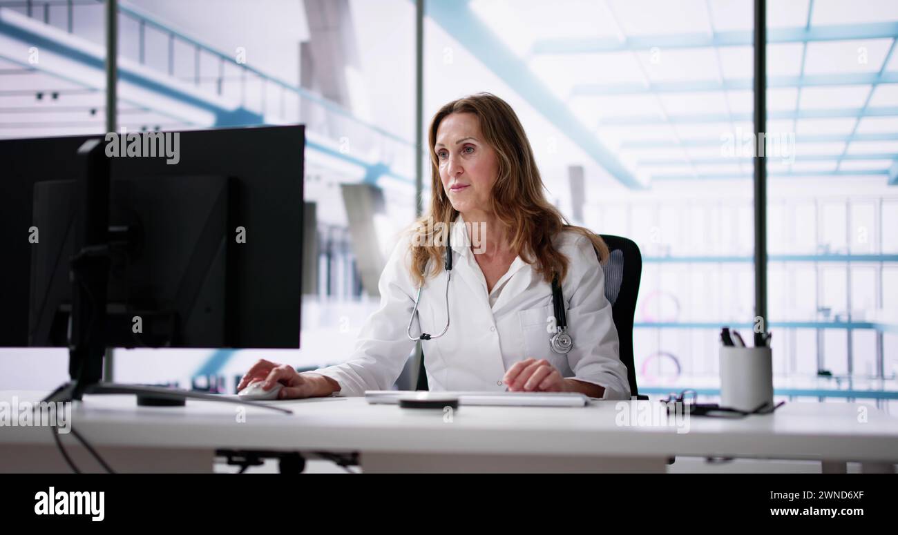 Medical Doctor Using Computer In Hospital. Lady Stock Photo - Alamy