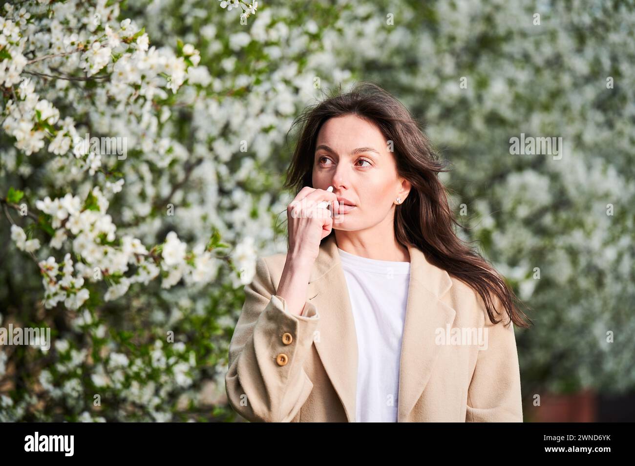 Woman allergic using medical nasal drops, suffering from seasonal ...