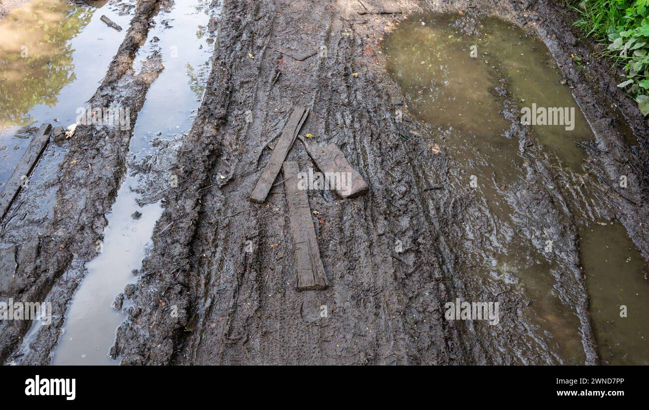 A neglected country road. Impassable broken dirt roads outside the city ...
