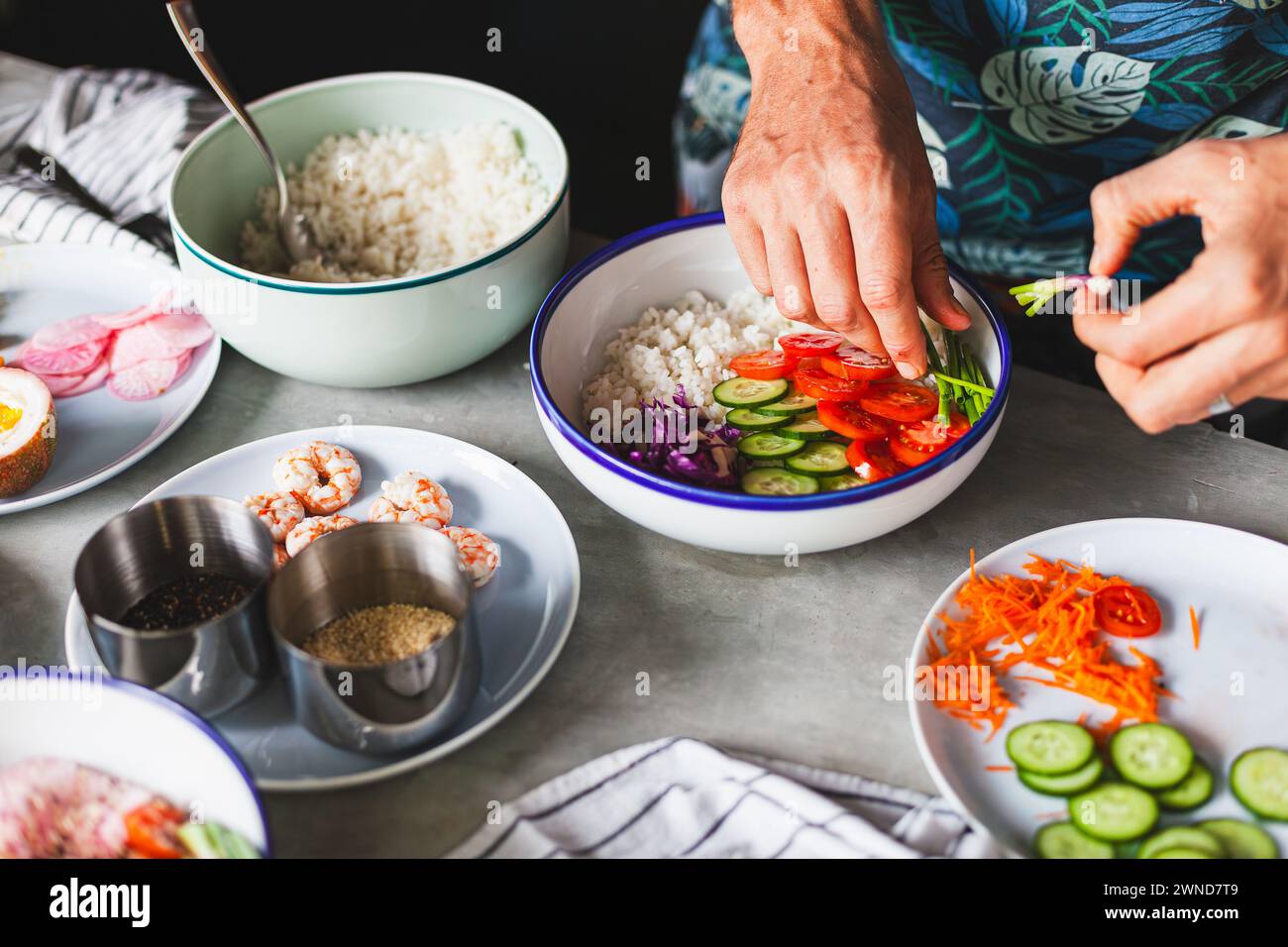 A poke bowl with shrimp prepared by the chef containing white rice ...