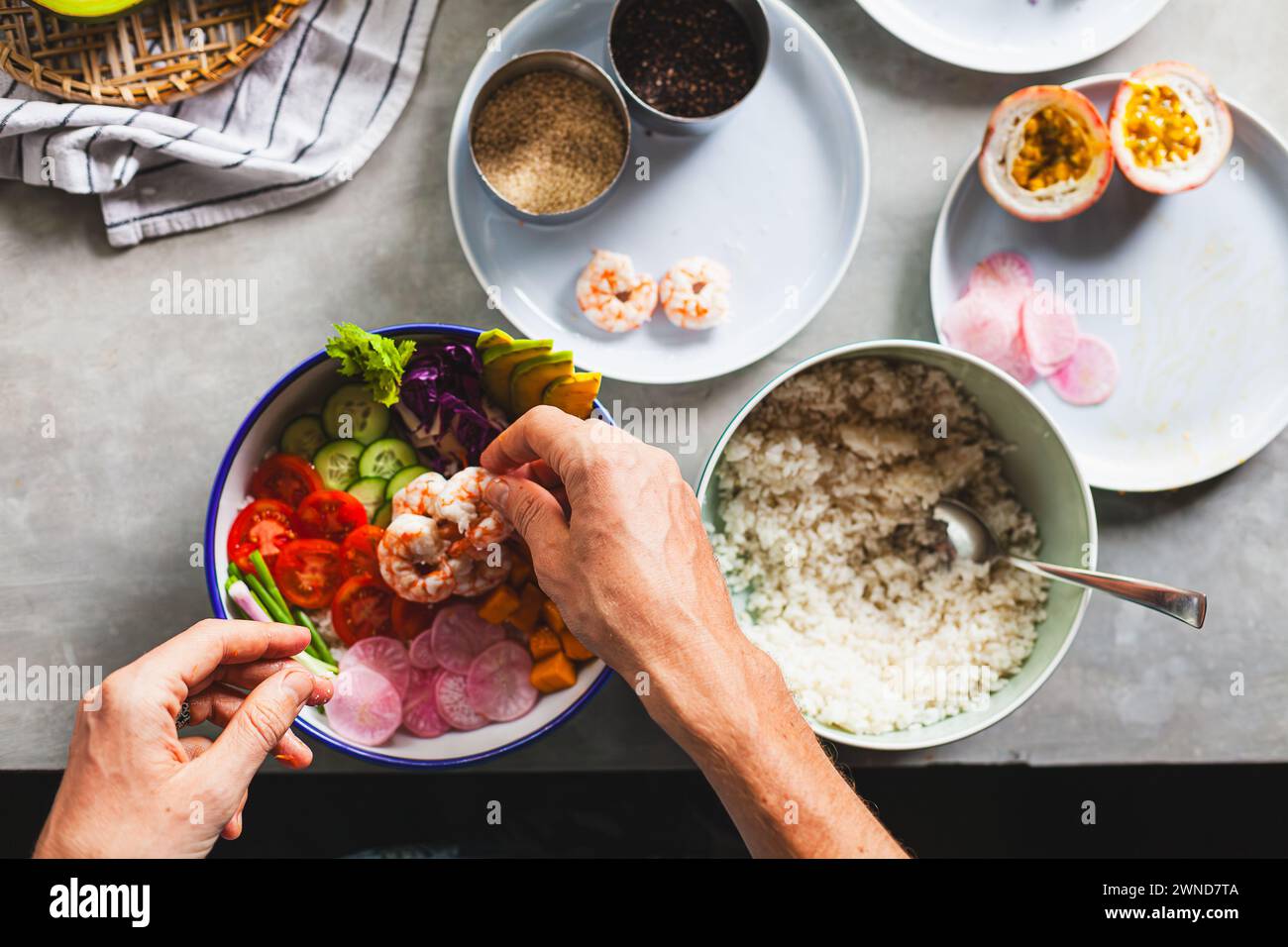 A poke bowl with shrimp prepared by the chef containing white rice ...