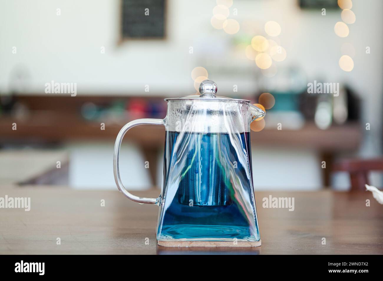 Iced water pitcher among table decor items Stock Photo - Alamy