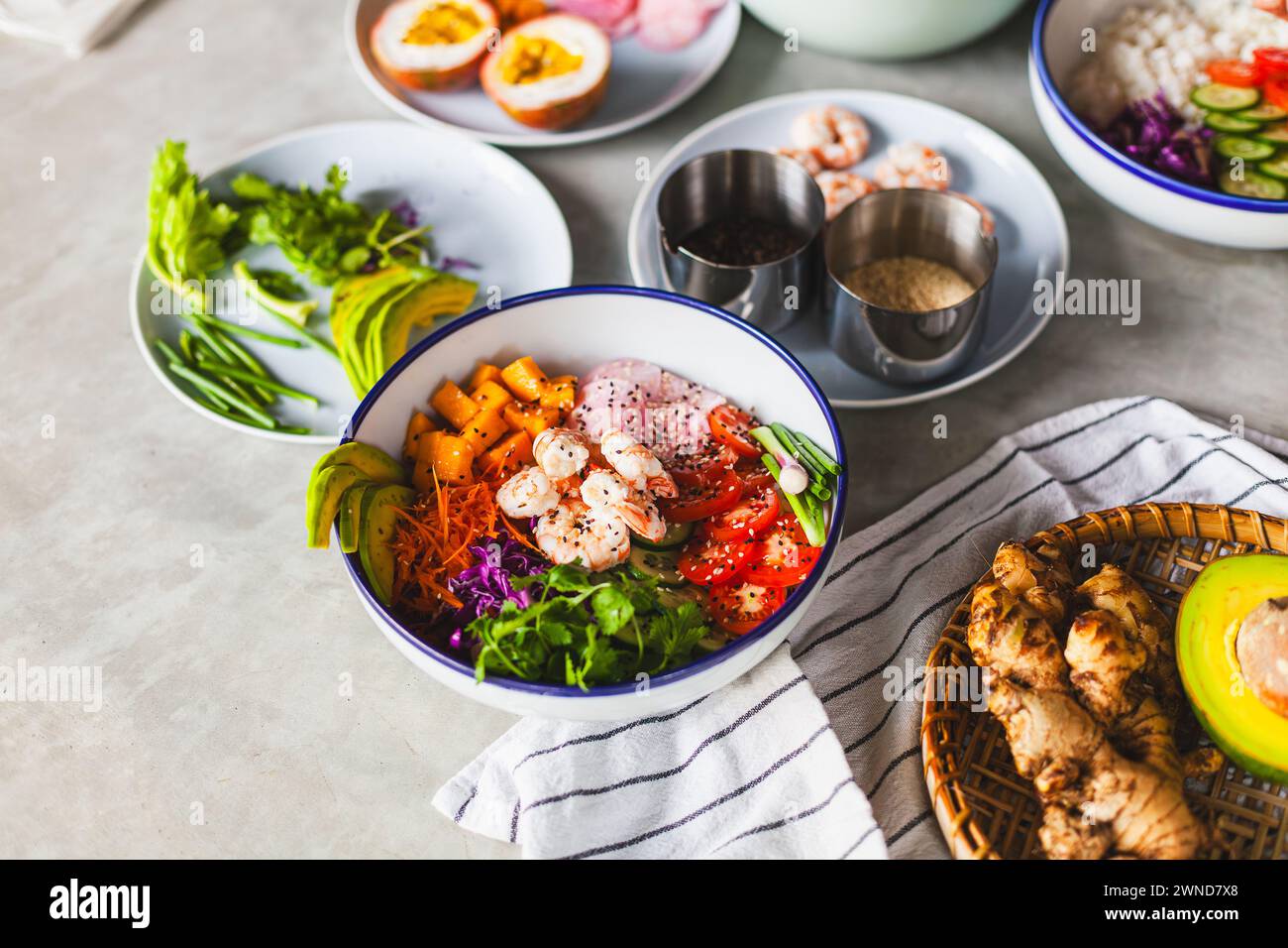A poke bowl with shrimp prepared by the chef containing white rice ...