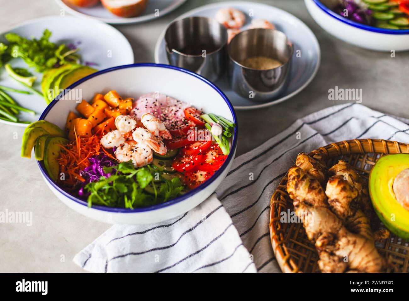 A poke bowl with shrimp prepared by the chef containing white rice ...