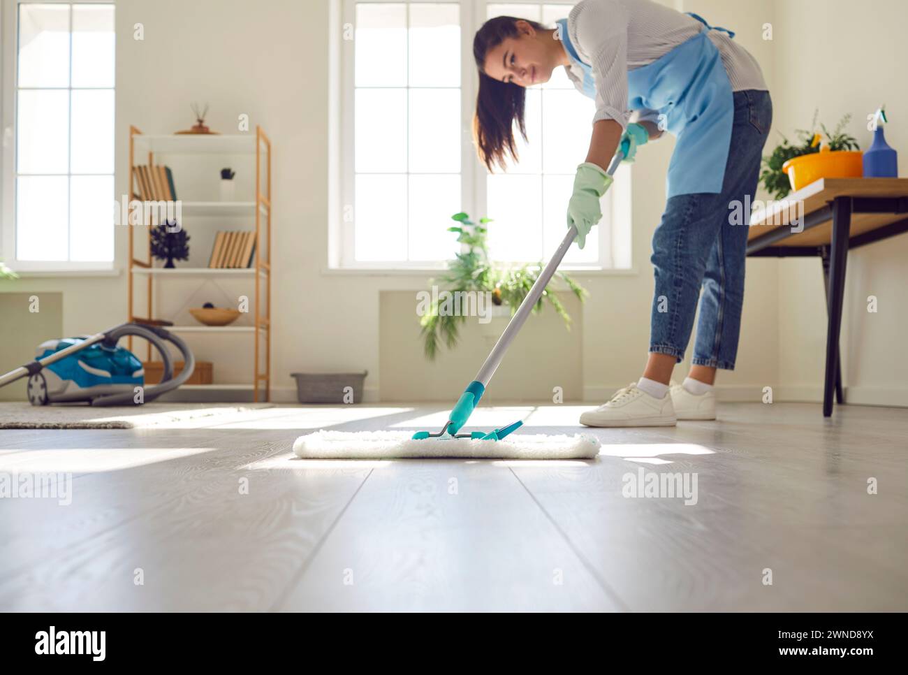 Housewife Mopping the Living Room Floor Stock Photo - Alamy