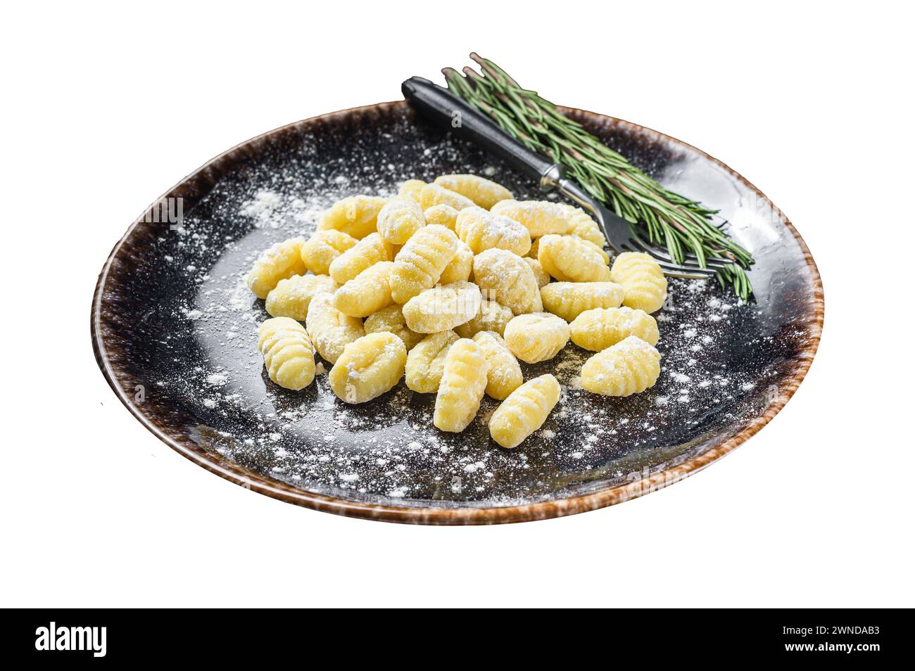 Italian gnocchi dumplings, Raw potato gnocchi on plate with thyme ...
