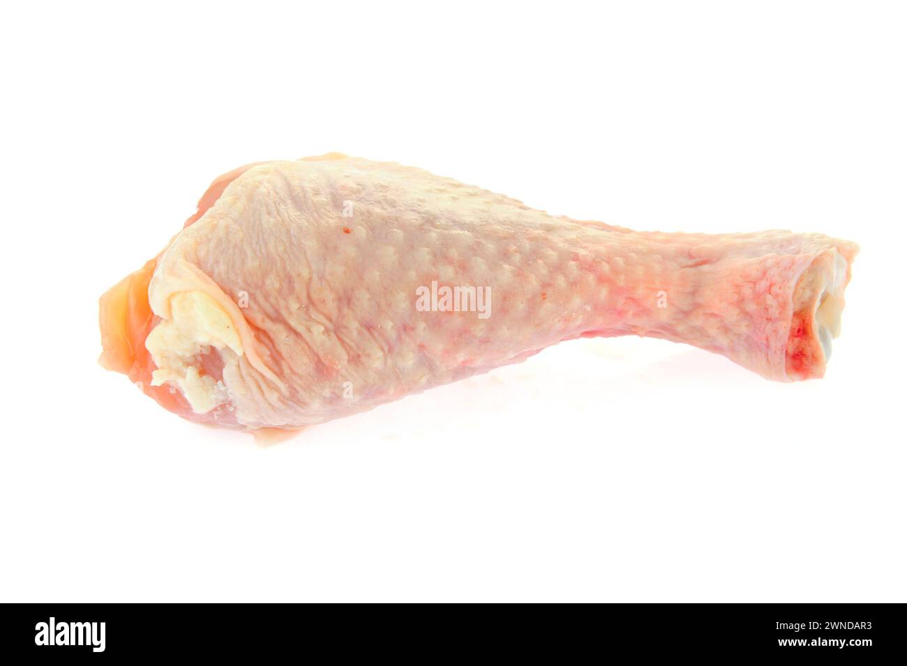 Raw chicken leg on a white background Stock Photo - Alamy