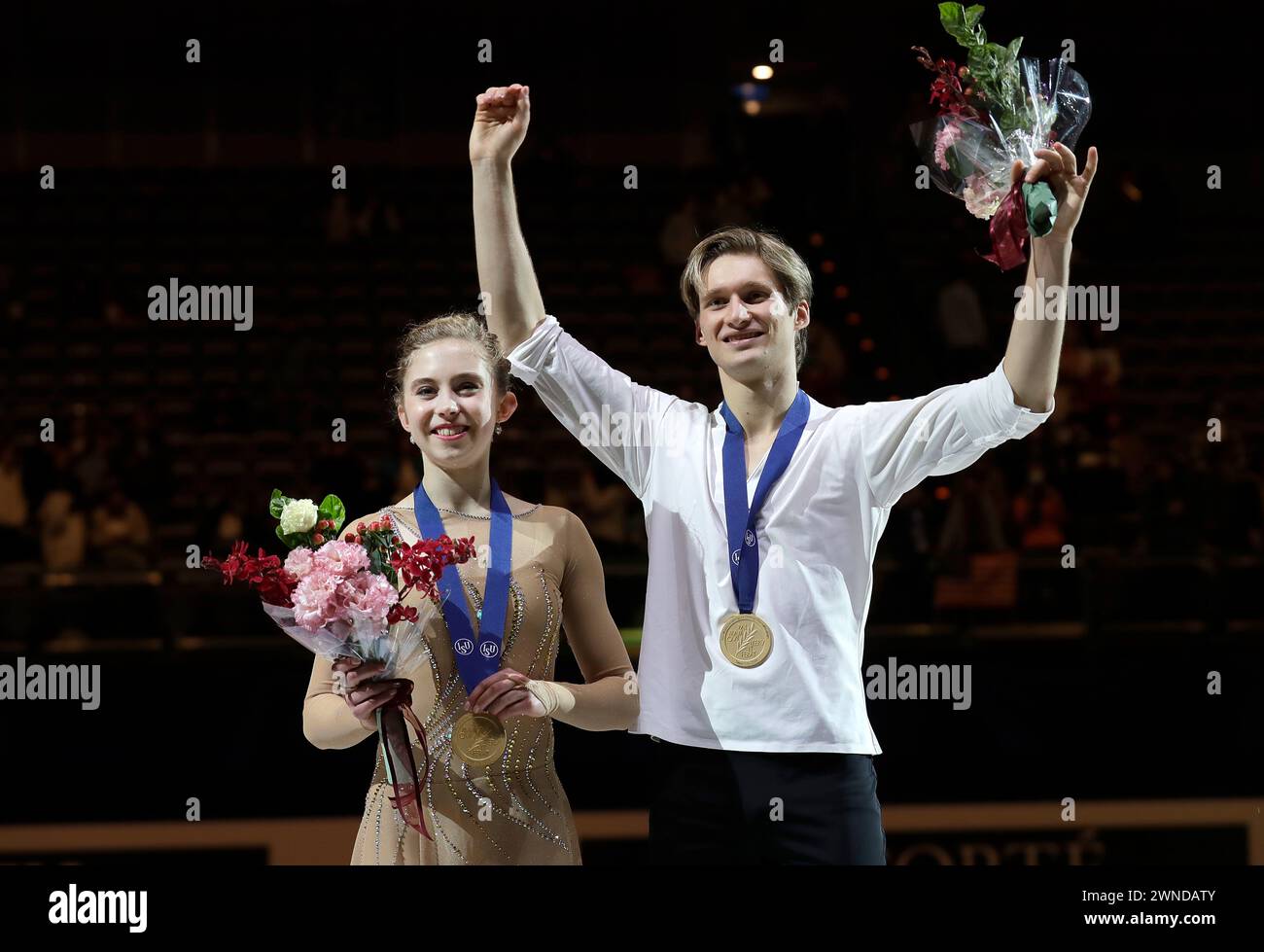 First place winner Leah Neset and Artem Markelov of the U.S. celebrate ...