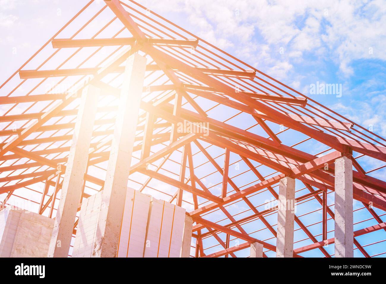 Steel roof frame structure of building house at construction site with ...