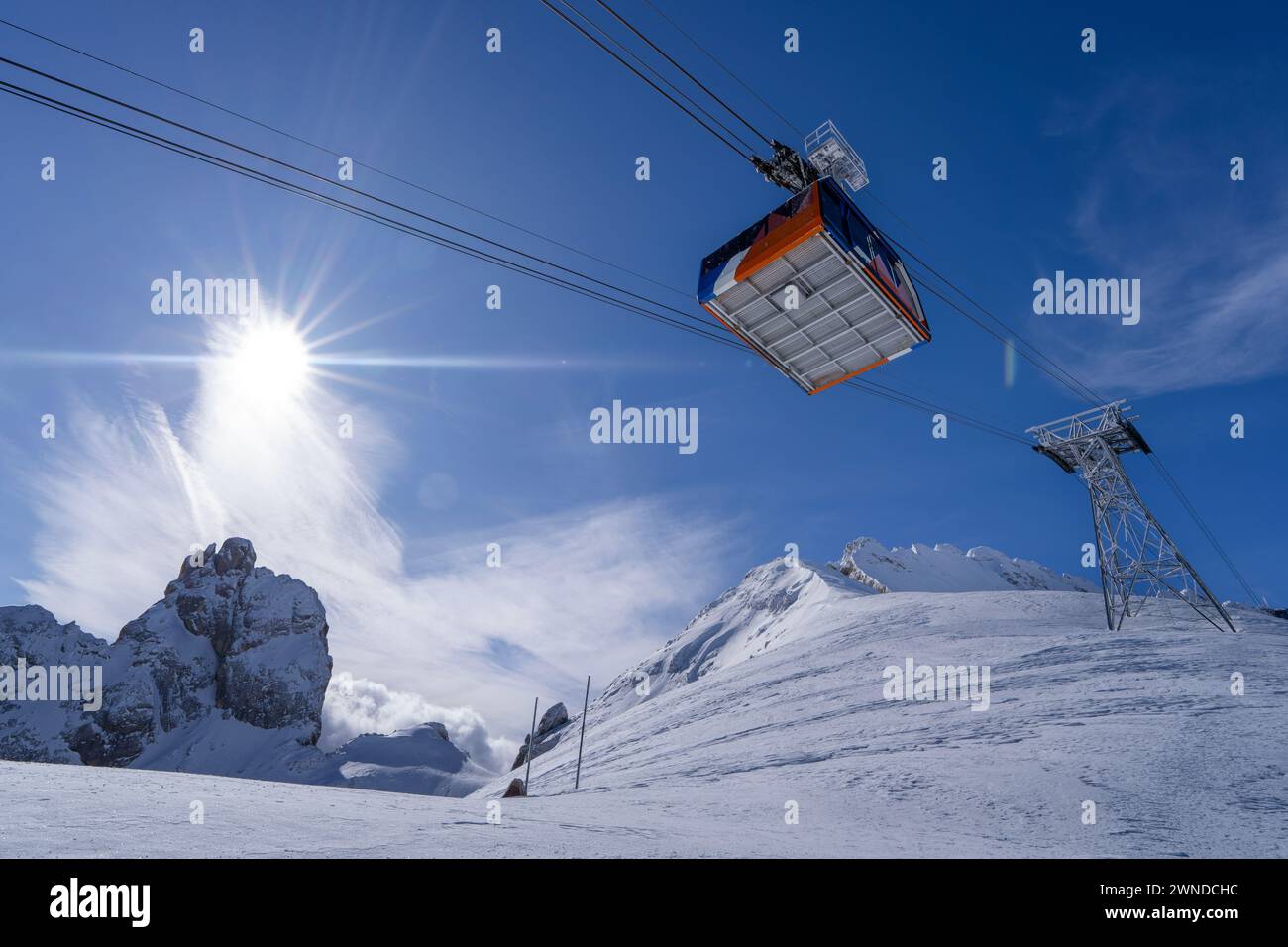 Sun-Kissed Peaks and Vibrant Cable Car in the Italian Alps Stock Photo ...