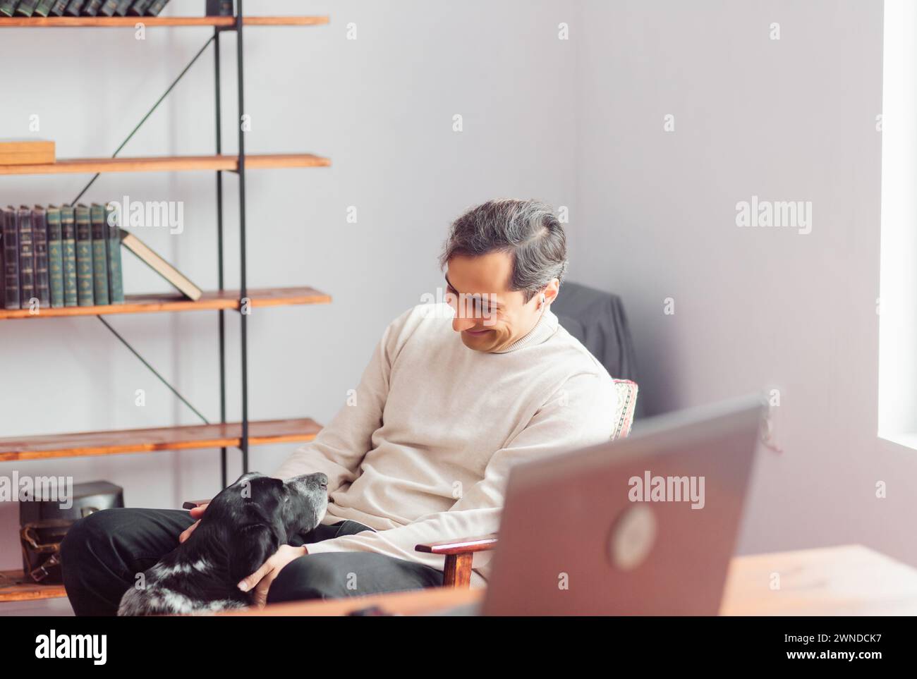 Portrait of two inseparable friends. A man takes his dog to work. The ...